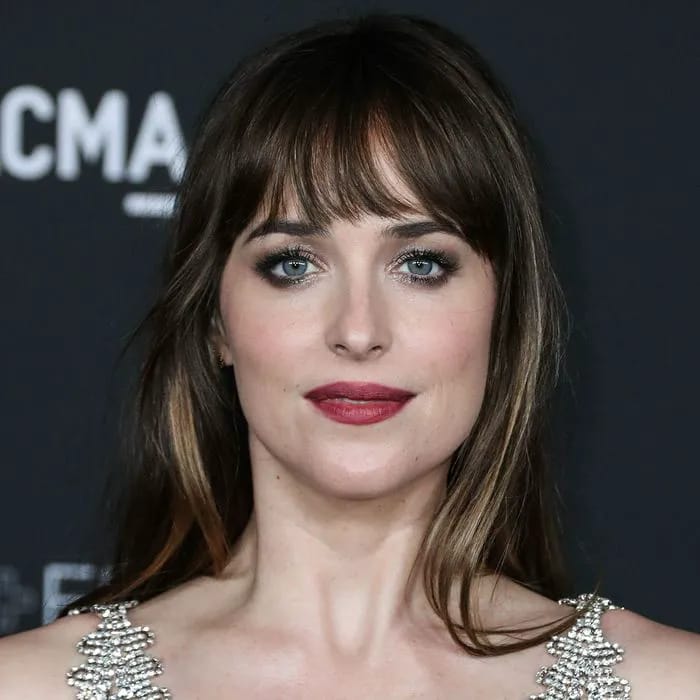 Dakota Johnson Shows Off Her Endless Legs In A Pinstripe Skirt Suit ...