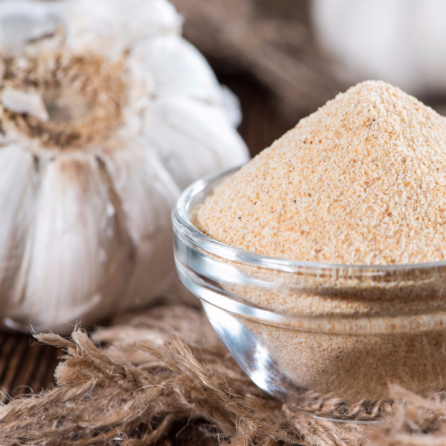 Why Sprinkling Garlic On Your Vegetables May Cause Bloating, According ...