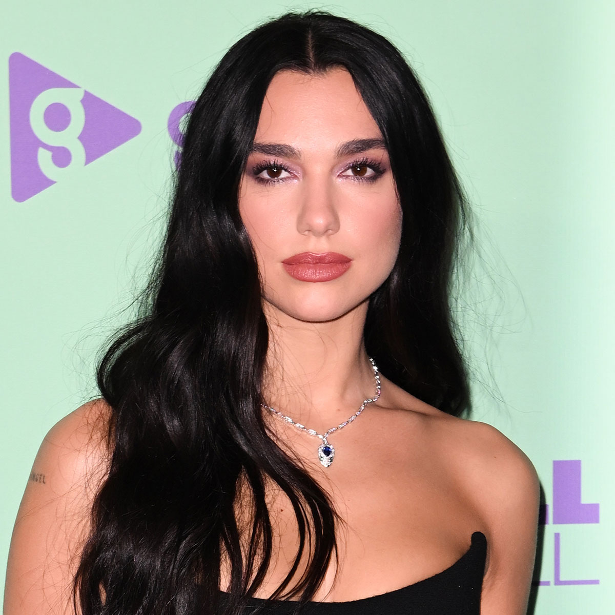 Dua Lipa Put A Twist On The Risqué Cardigan Trend With A Flirty ...