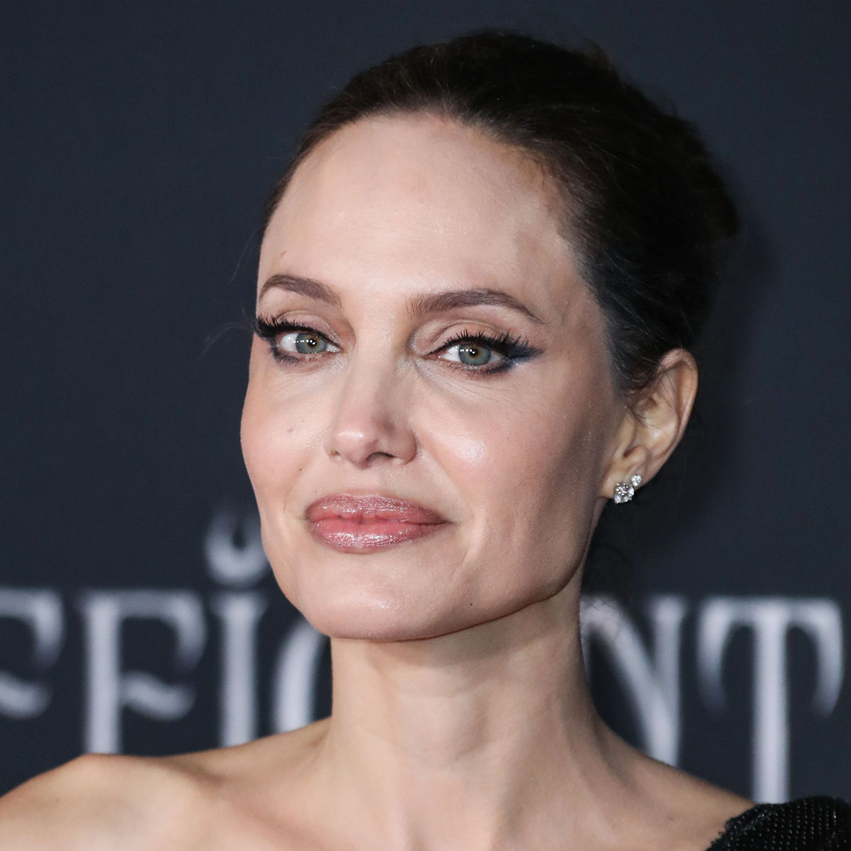 Margot Robbie Flashes Her Abs In A Black Peek-A-Boo Crop Top At The ...