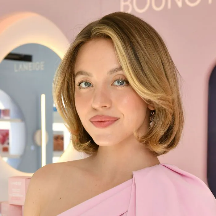 Sydney Sweeney Shines In A Chic One-Shoulder Jumpsuit For Skincare ...